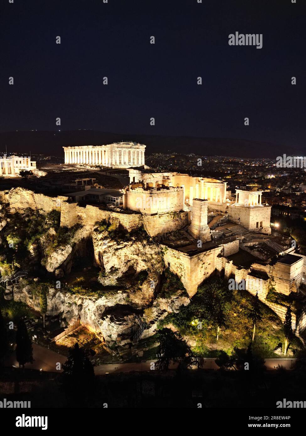 An aerial view of the illuminated Acropolis of Athens at night. Greece ...