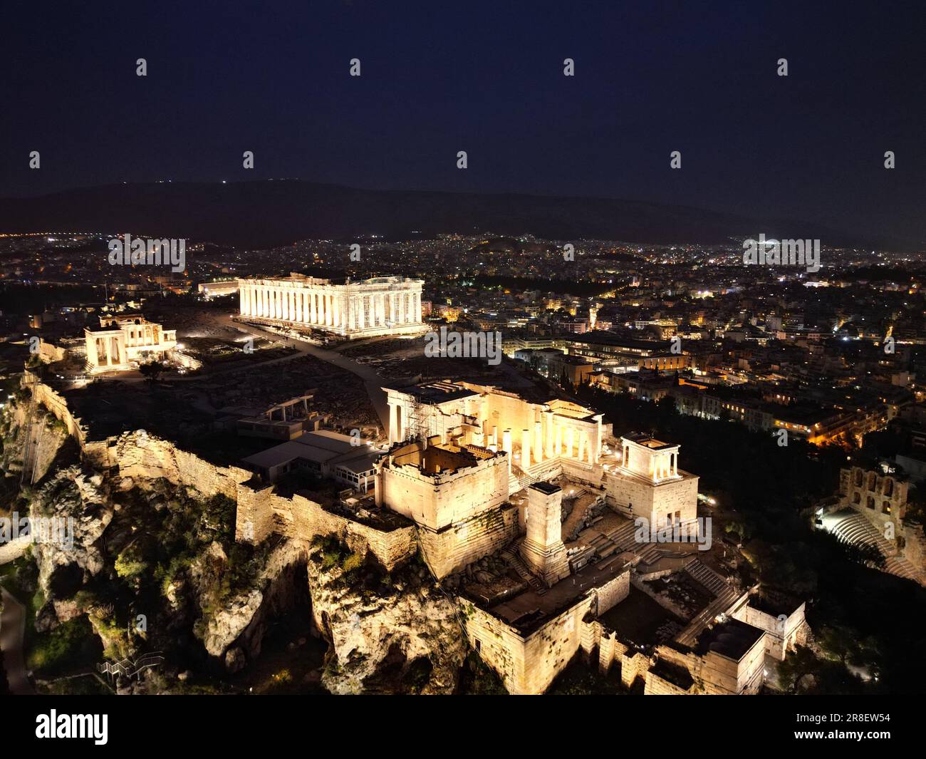 An aerial view of the illuminated Acropolis of Athens at night. Greece ...