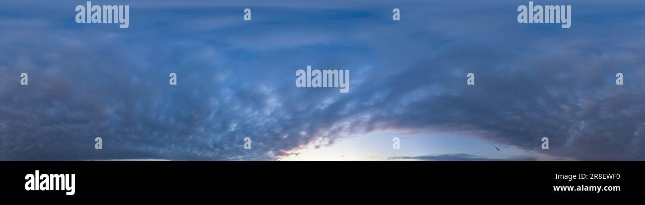 Sunset sky panorama with dramatic bright glowing pink Cumulus clouds ...