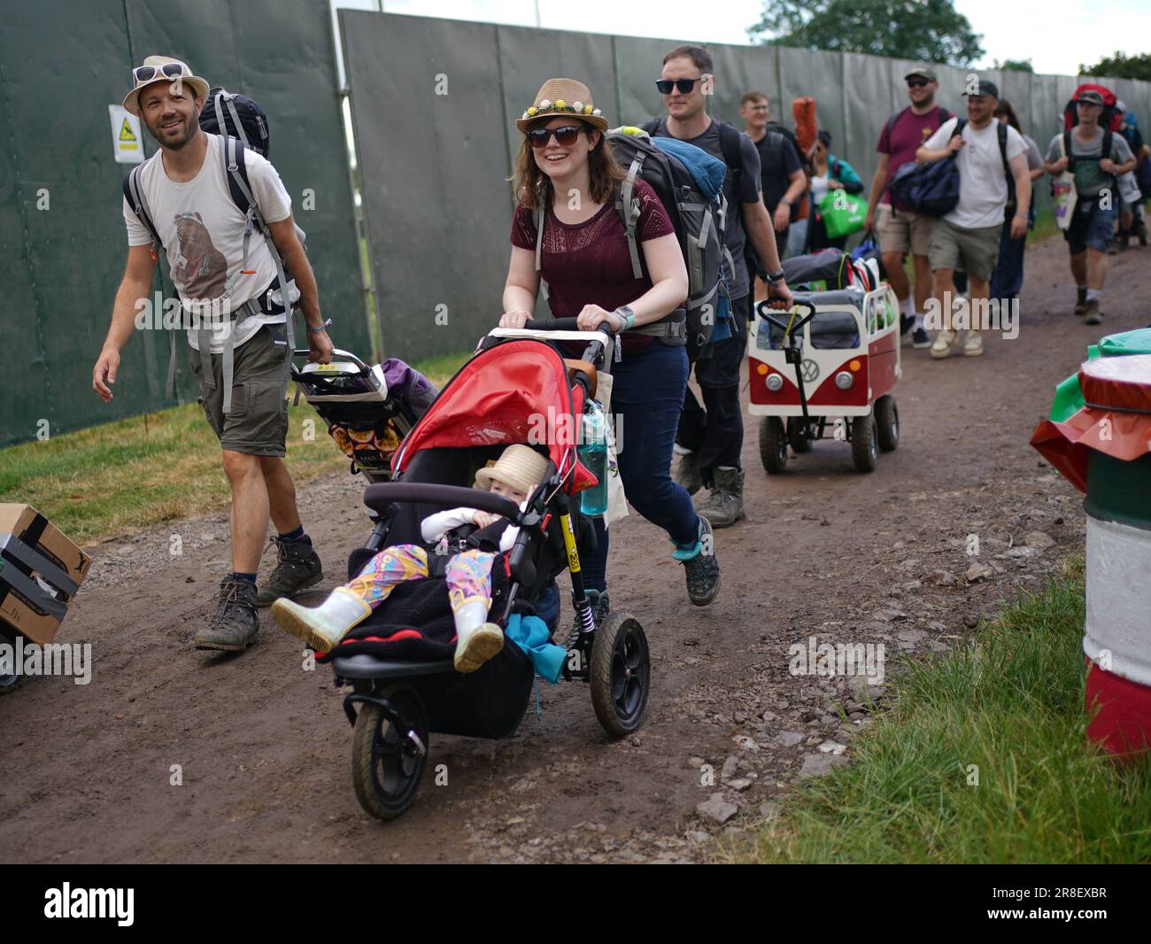 Festivalgoers Justin (blue top) and Amy Martindale from Southsea in ...