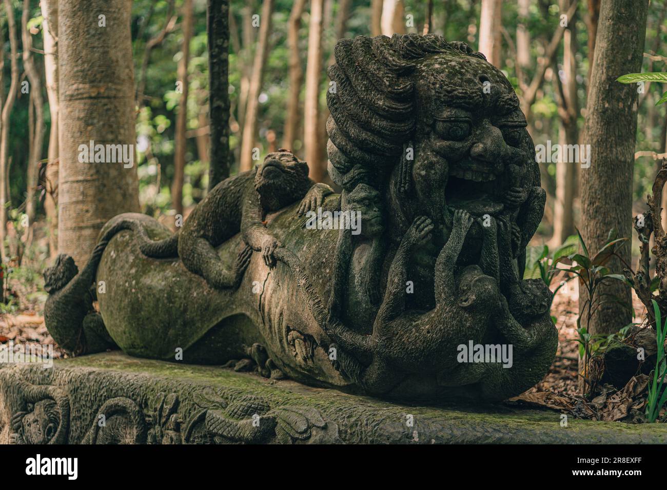 Old monkey sculpture in sacred monkey forest. Indonesian stone statue ...