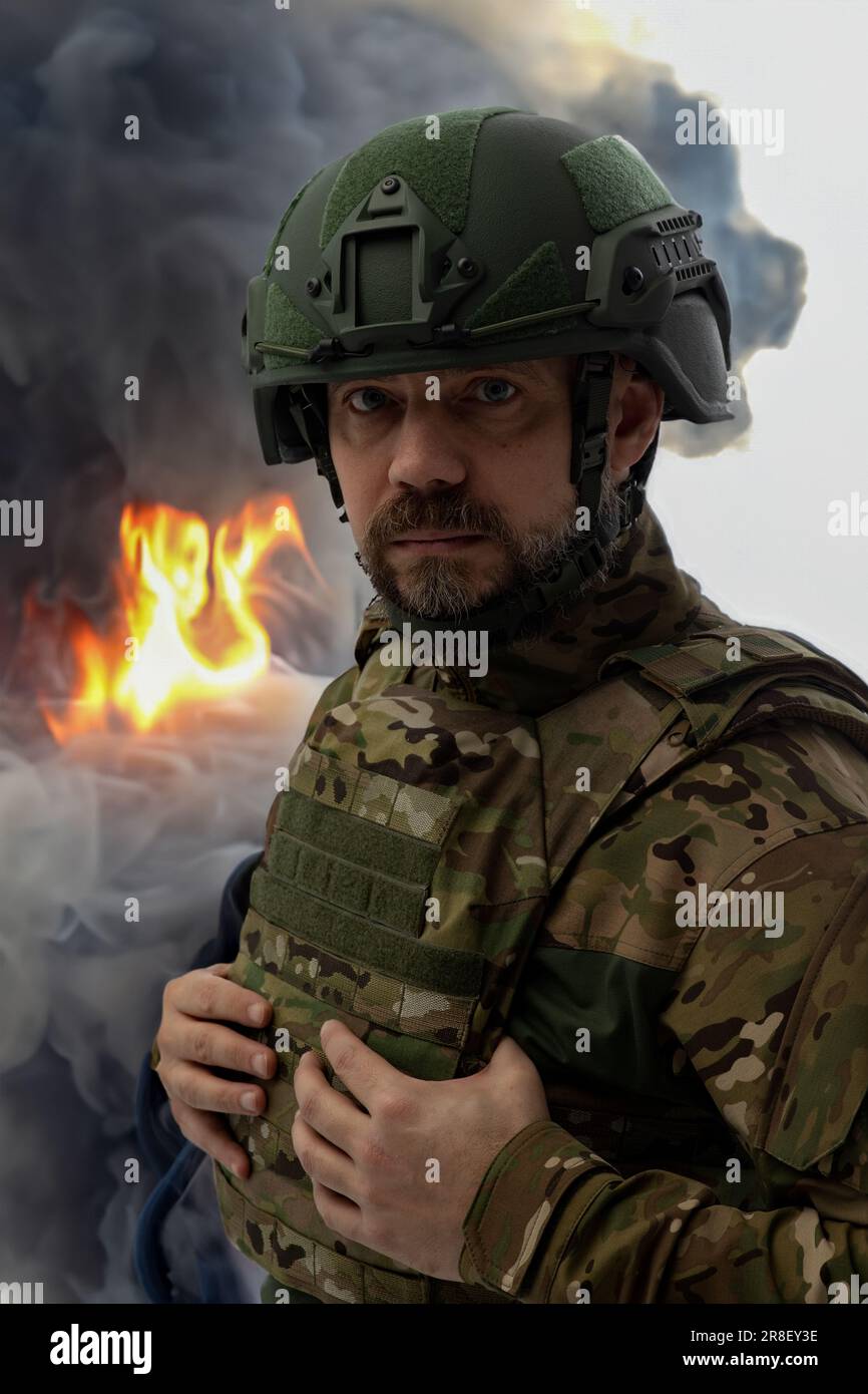 Portrait of a military soldier in uniform, helmet and body armor ...