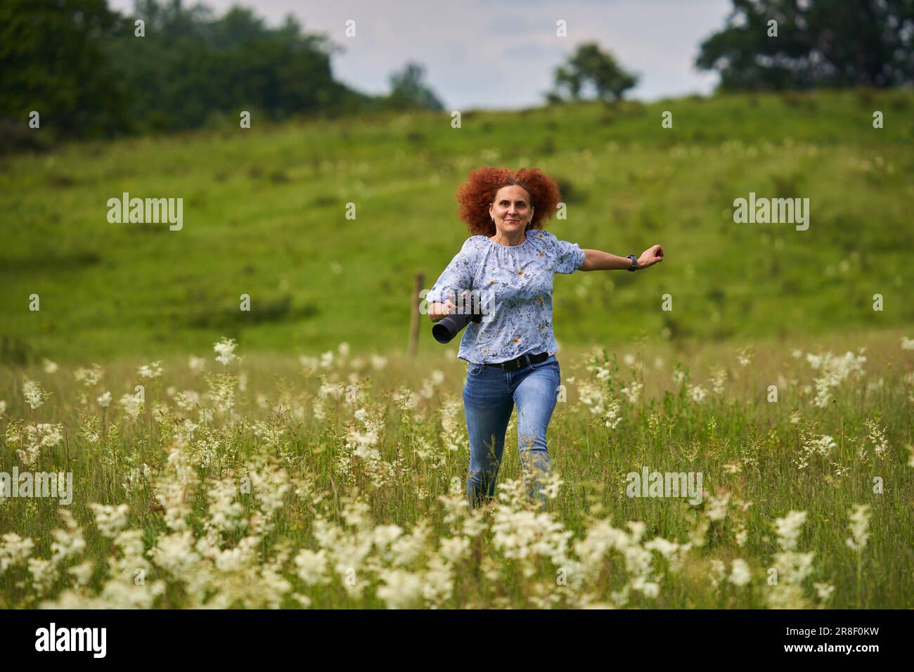 Female photographer running hi-res stock photography and images - Alamy
