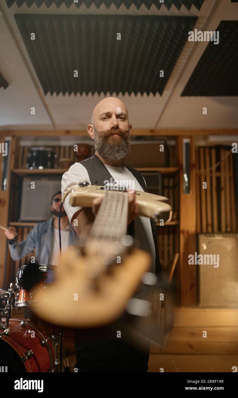 Portrait of rock band guitarist with his music instrument Stock Photo ...