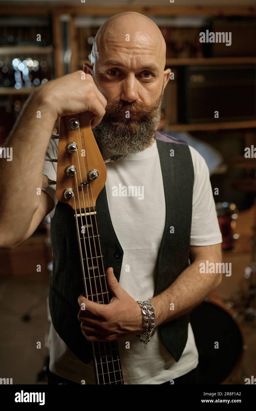 Portrait of rock band guitarist with his music instrument Stock Photo ...
