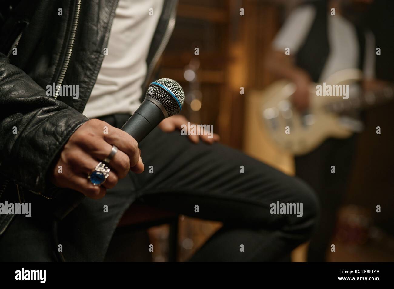 Closeup view of rock singer hand holding dynamic microphone Stock Photo ...