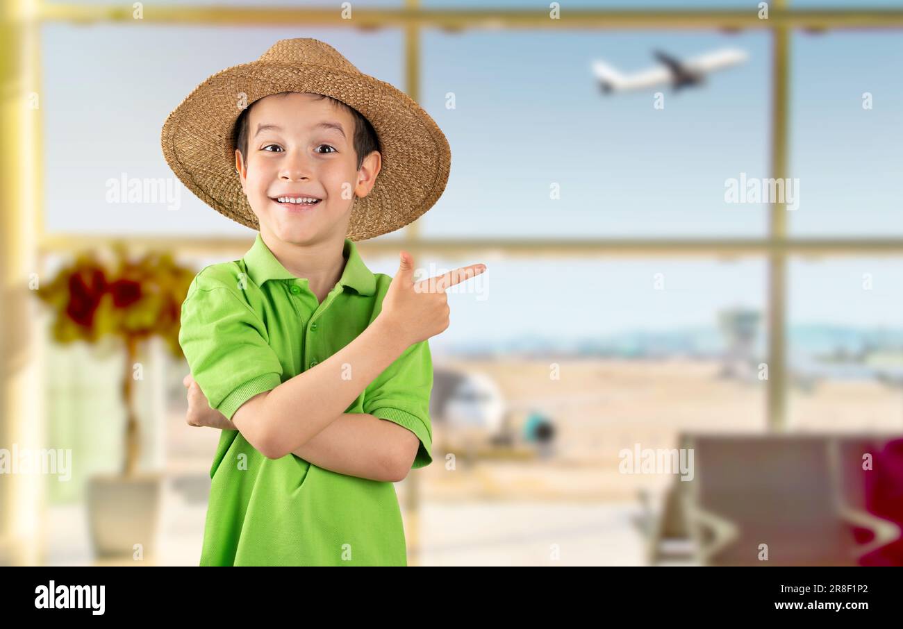 Boy looking up indicating hand hi-res stock photography and images - Alamy