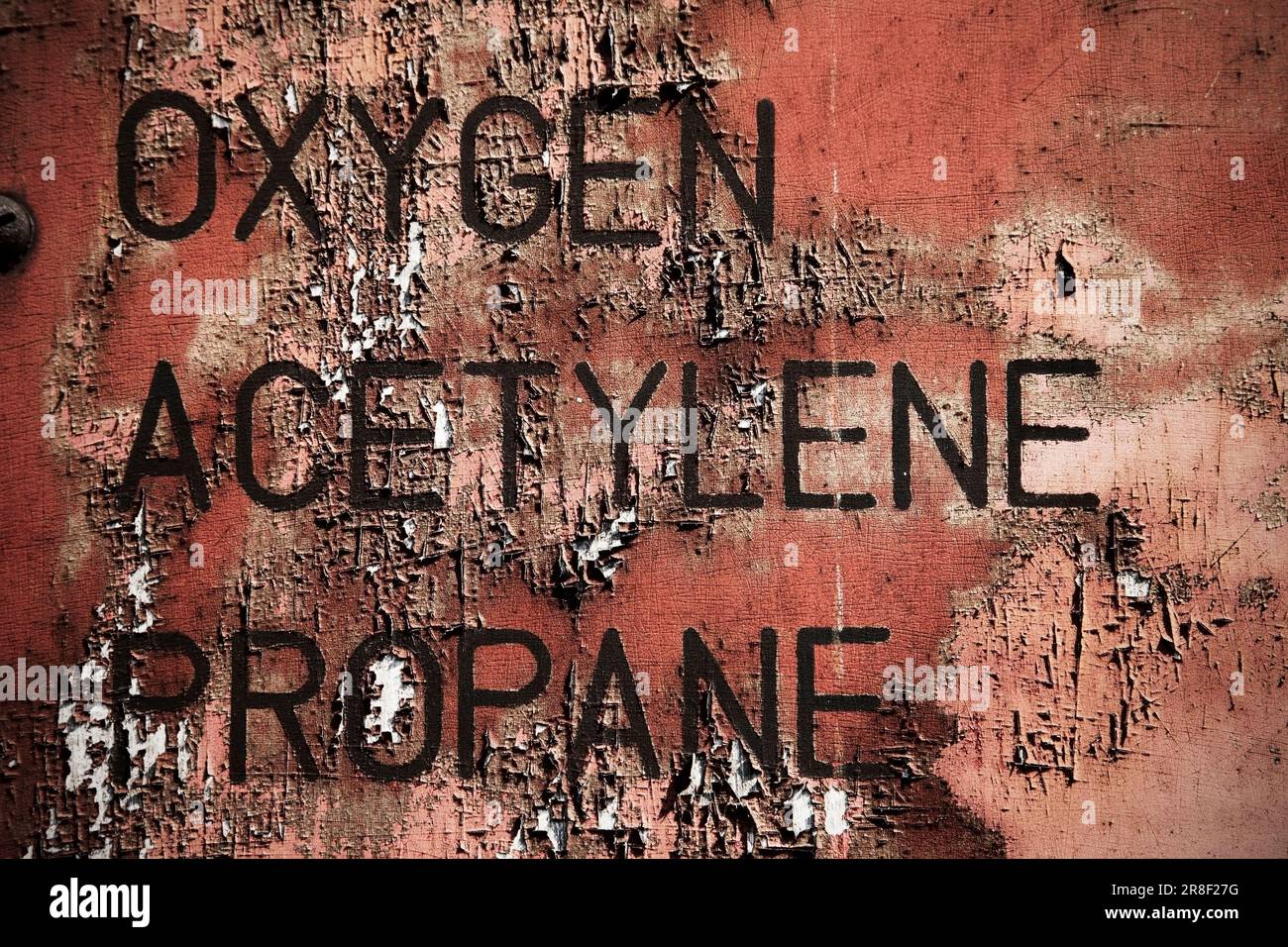 Old sign for industrial gas tanks containing oxygen, acetylene and ...