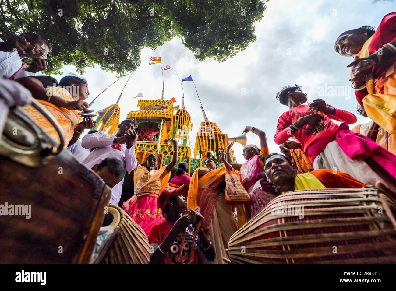 Guptipara, India. 20th June, 2023. Hindu devotees seen chanting beside the Chariot of Lord ...