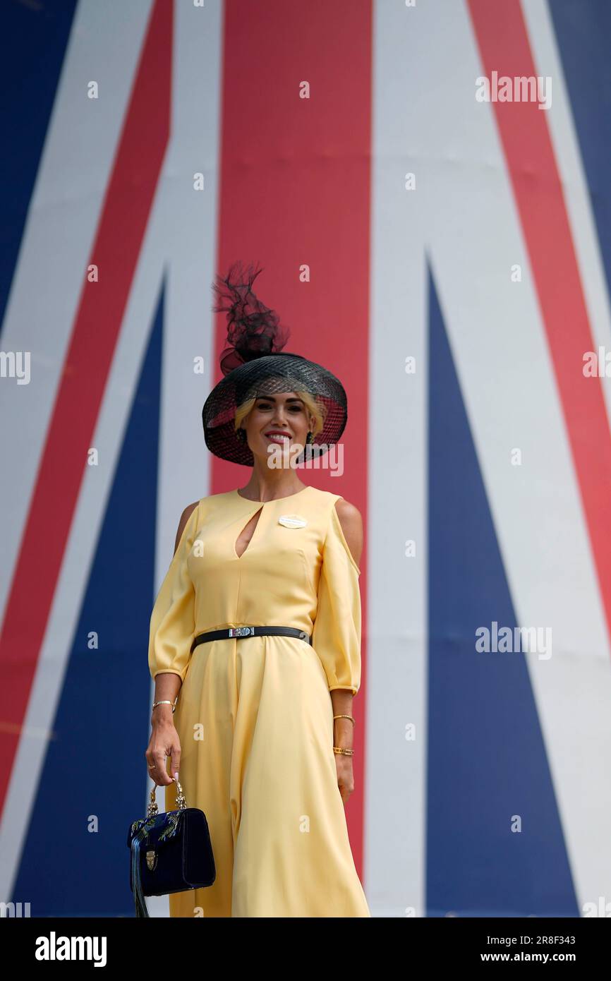 Racegoer Kate Ozerov poses for pictures as she arrives for day two of ...