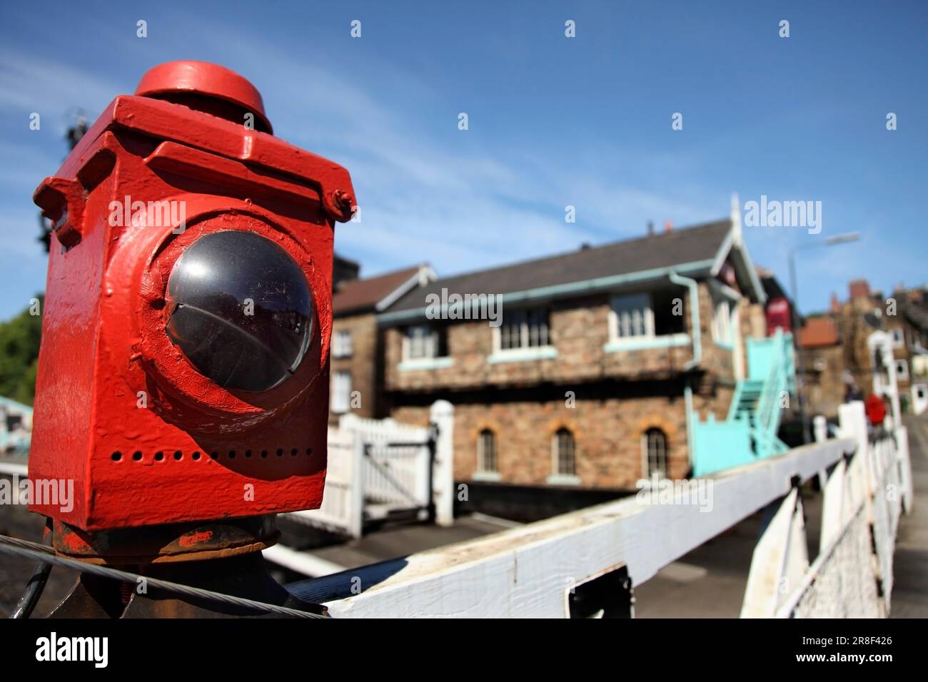 Warning light on level crossing gates at Grosmont station, North ...