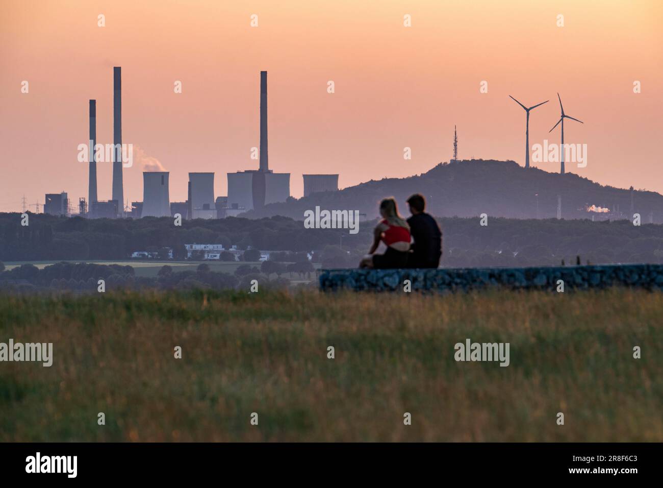 Sunset view to the west, UNIPER power plant Scholven and wind turbines ...