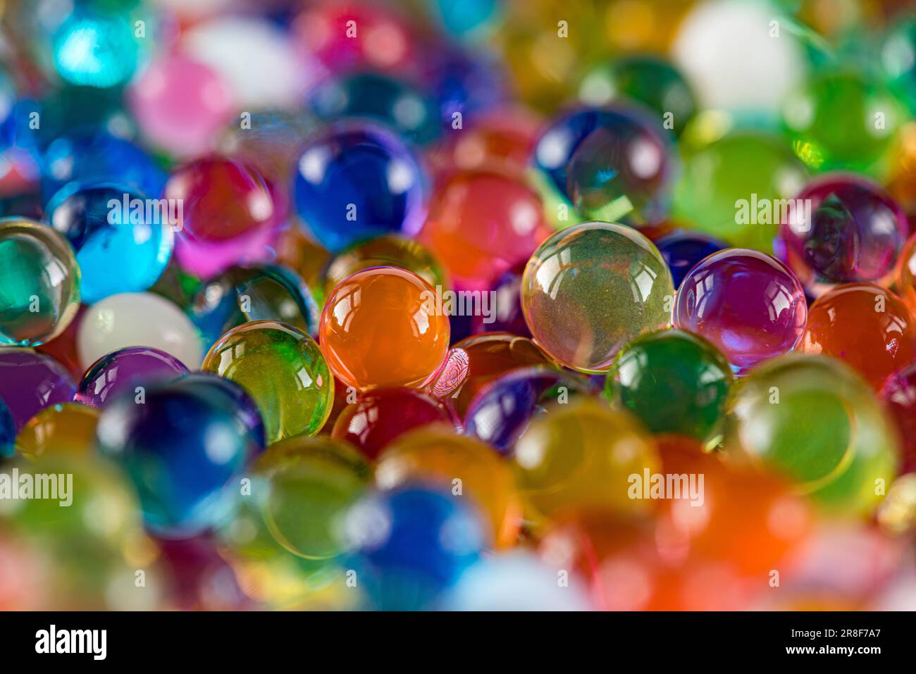 Water beads close-up, abstract background. Texture of Hydrogel balls or ...