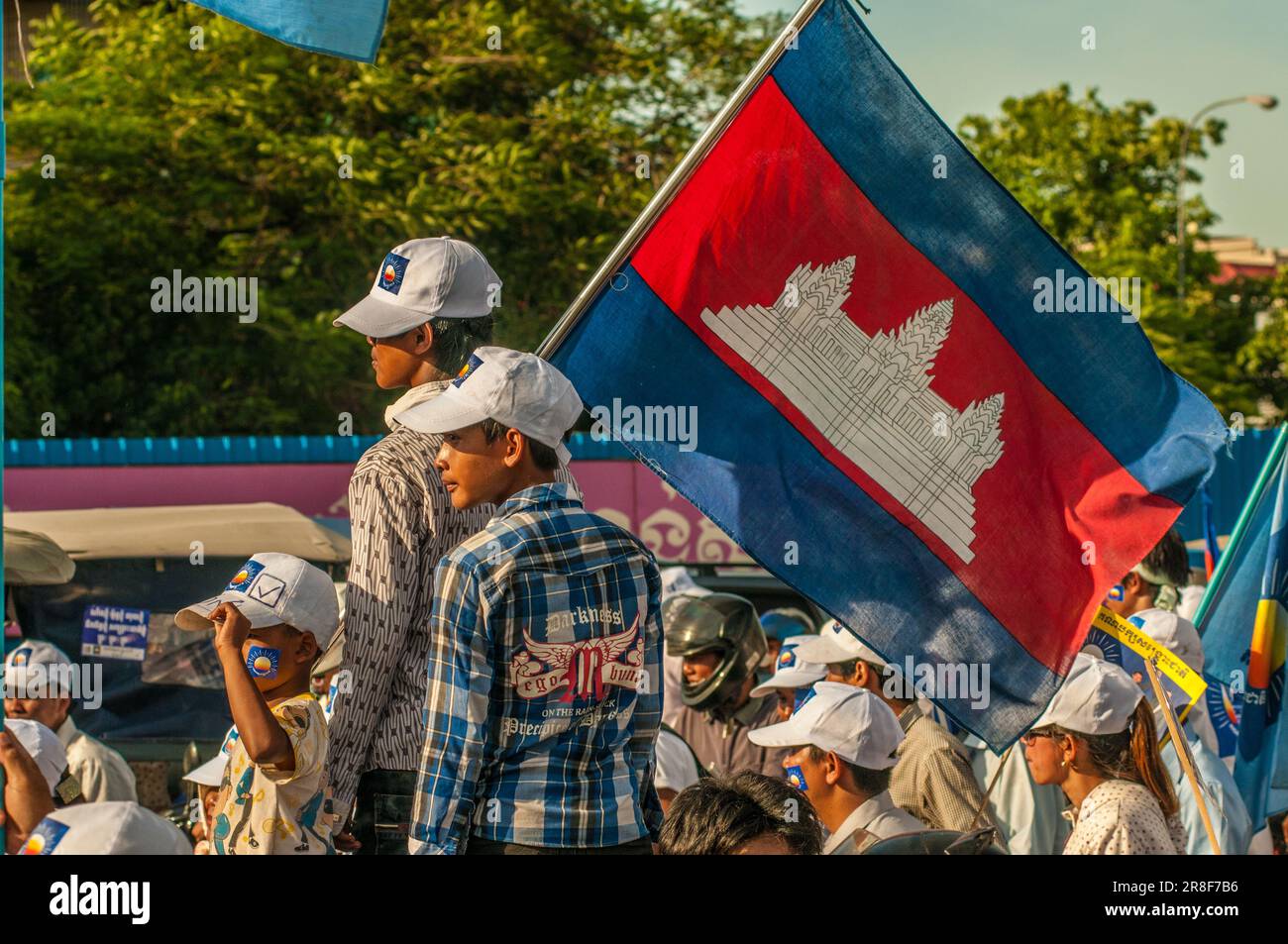Sam Rainsy supporters w/ a Cambodian flag during a political motorcycle ...