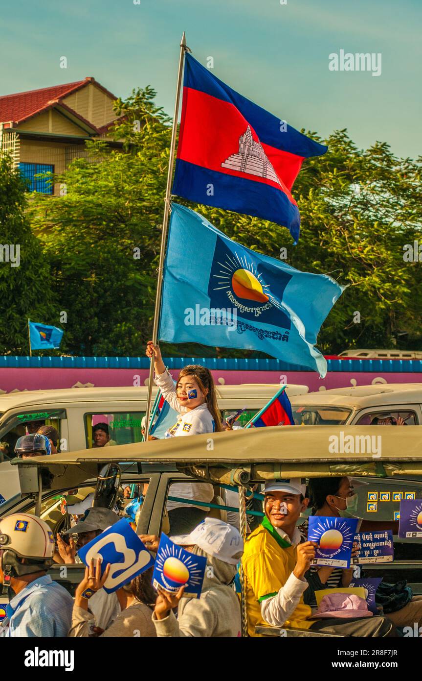 Sam Rainsy supporter waving both the Cambodian flag & the flag of Sam ...