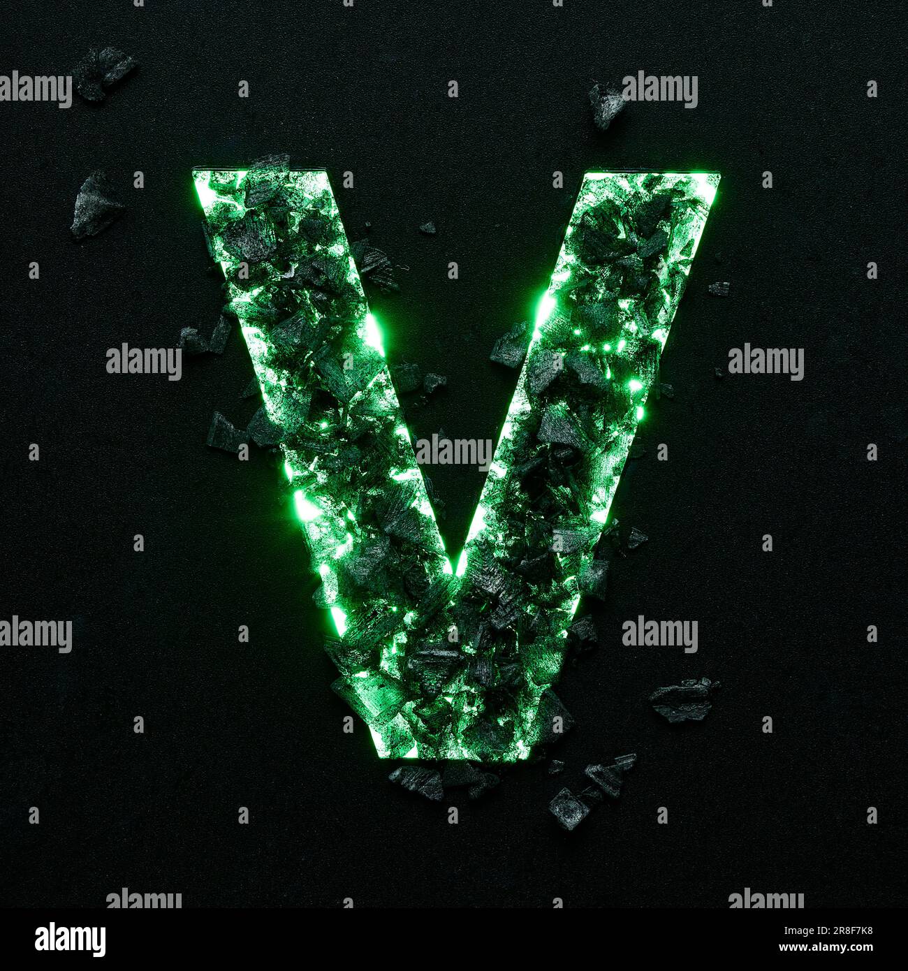 High quality photo of green colored capital letter on a black textured ...