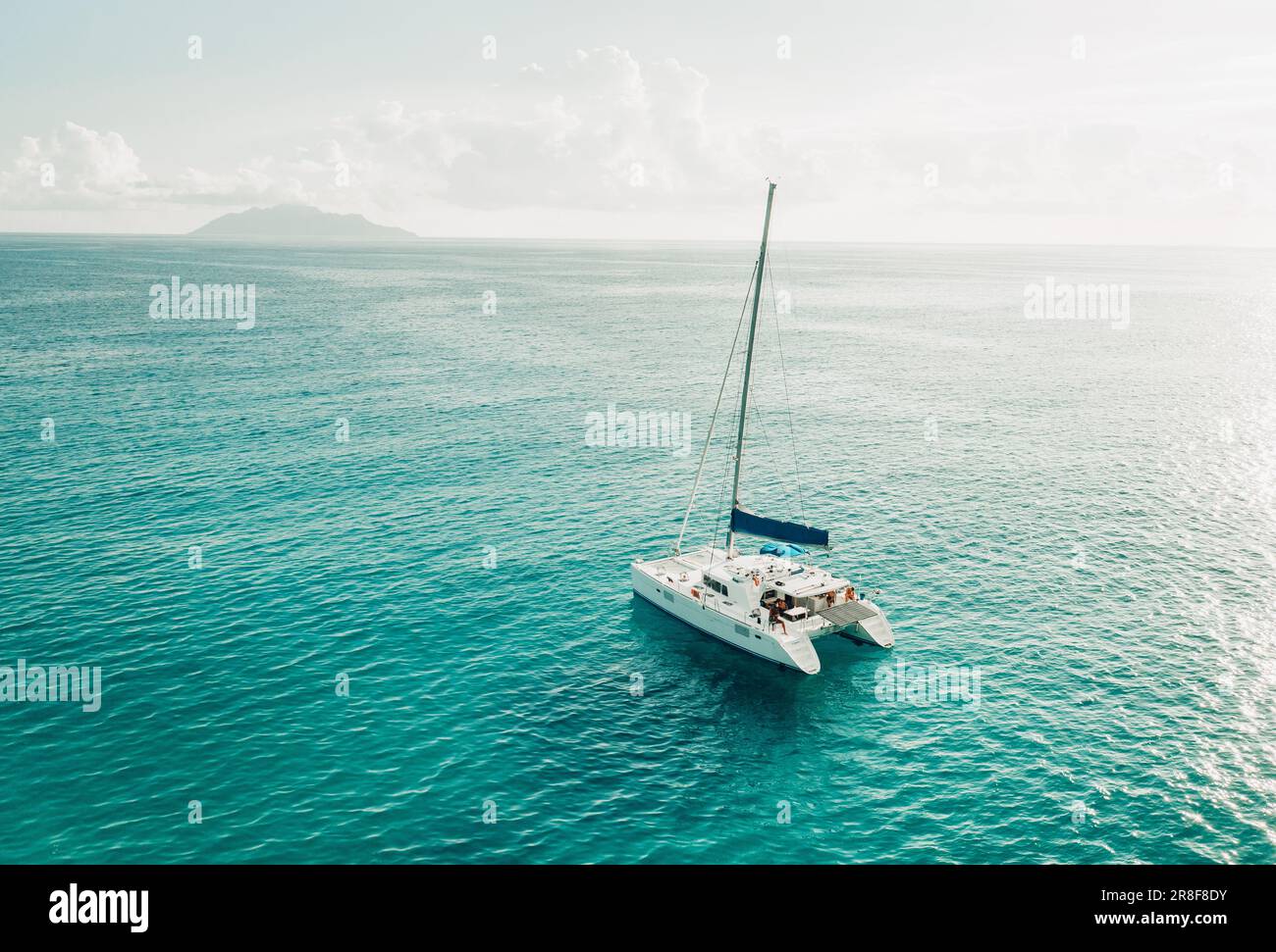 Catamaran Sailing in the Indian Ocean at Sunset Stock Photo - Alamy