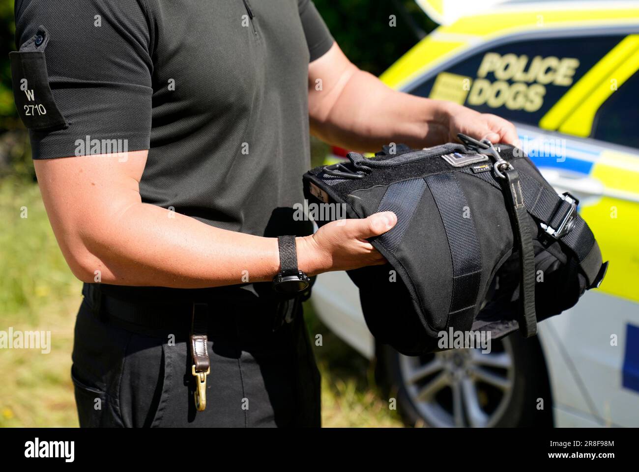 A Wiltshire police dog handler displays body armour worn by police dogs ...