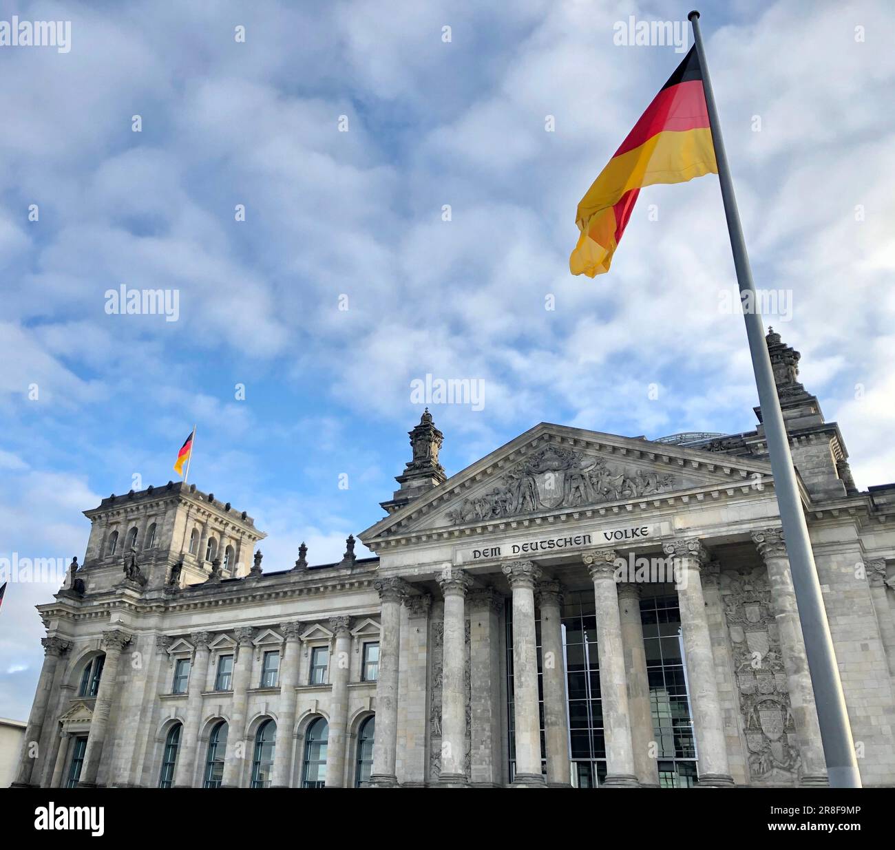 A low angle of the Reichstag building in Berlin, Germany, with the ...