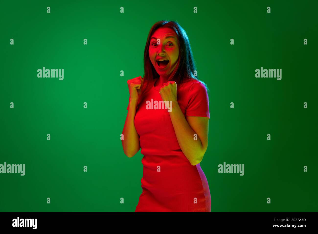 Happy lucky look. Young emotive woman posing with winning expression ...