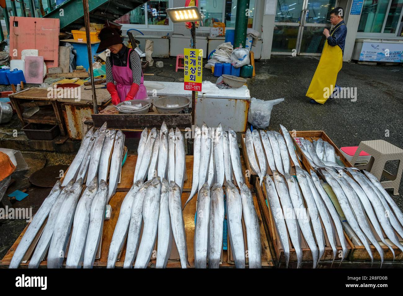 Busan, South Korea - May 28, 2023: A woman selling fish in Jagalchi ...