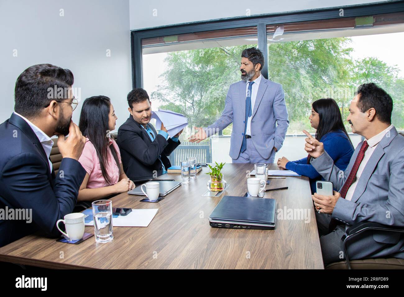 Angry indian boss screaming at male employee for bad work, Businessman ...