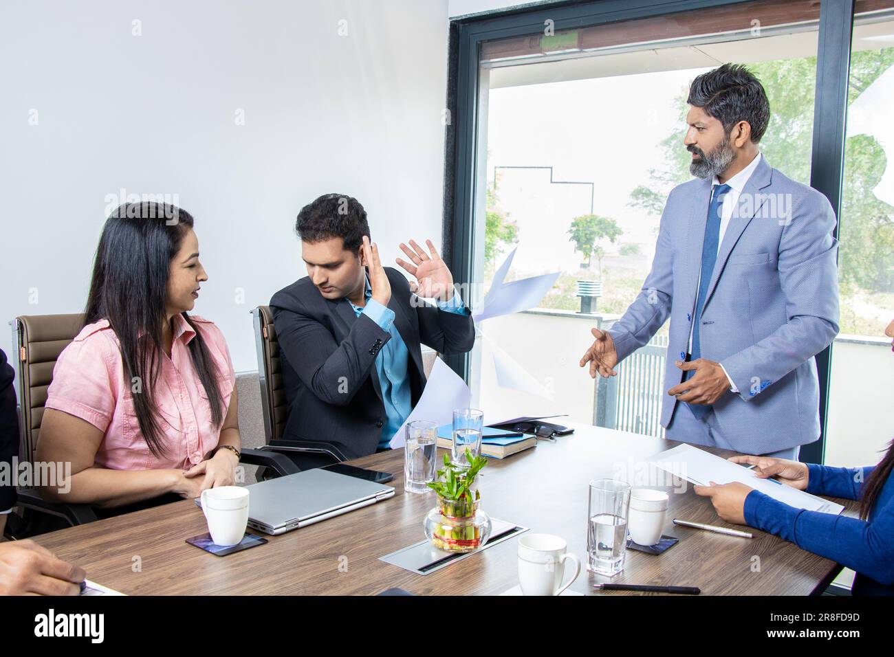 Angry indian boss screaming at male employee for bad work, Businessman ...