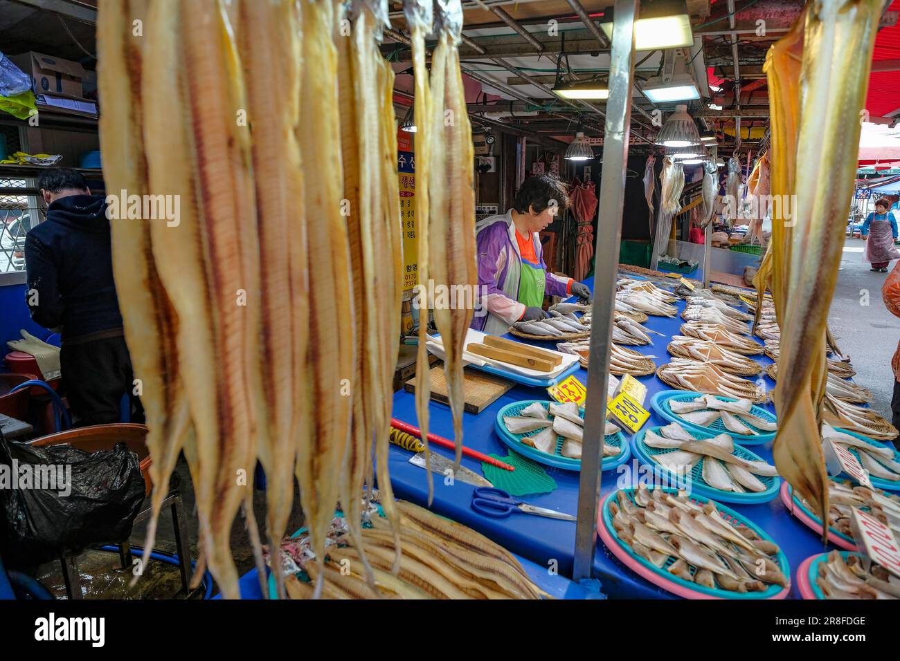 Busan, South Korea - May 28, 2023: A woman selling fish in Jagalchi ...