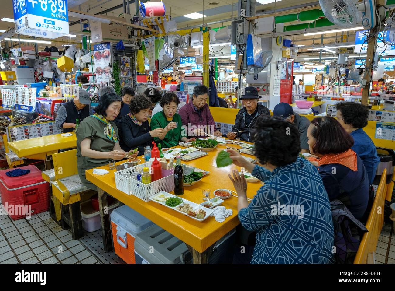 Busan, South Korea - May 28, 2023: People eating fish in the Jagalchi ...