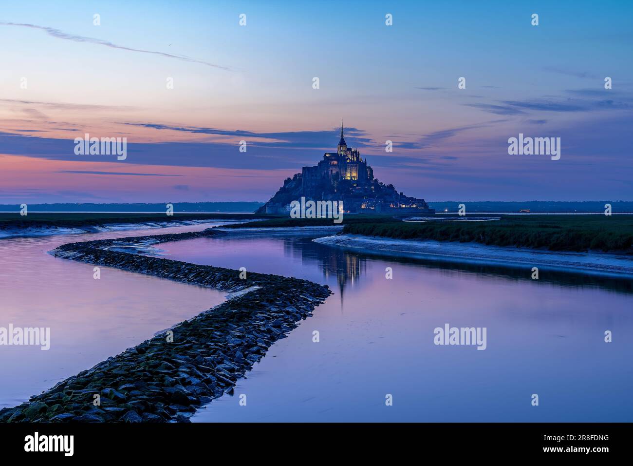 A sunrise view of the historic Mont Saint Michel castle in France ...