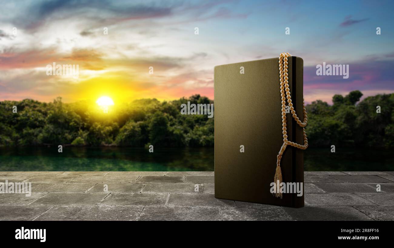 Quran and prayer beads with the sunset scene background Stock Photo - Alamy