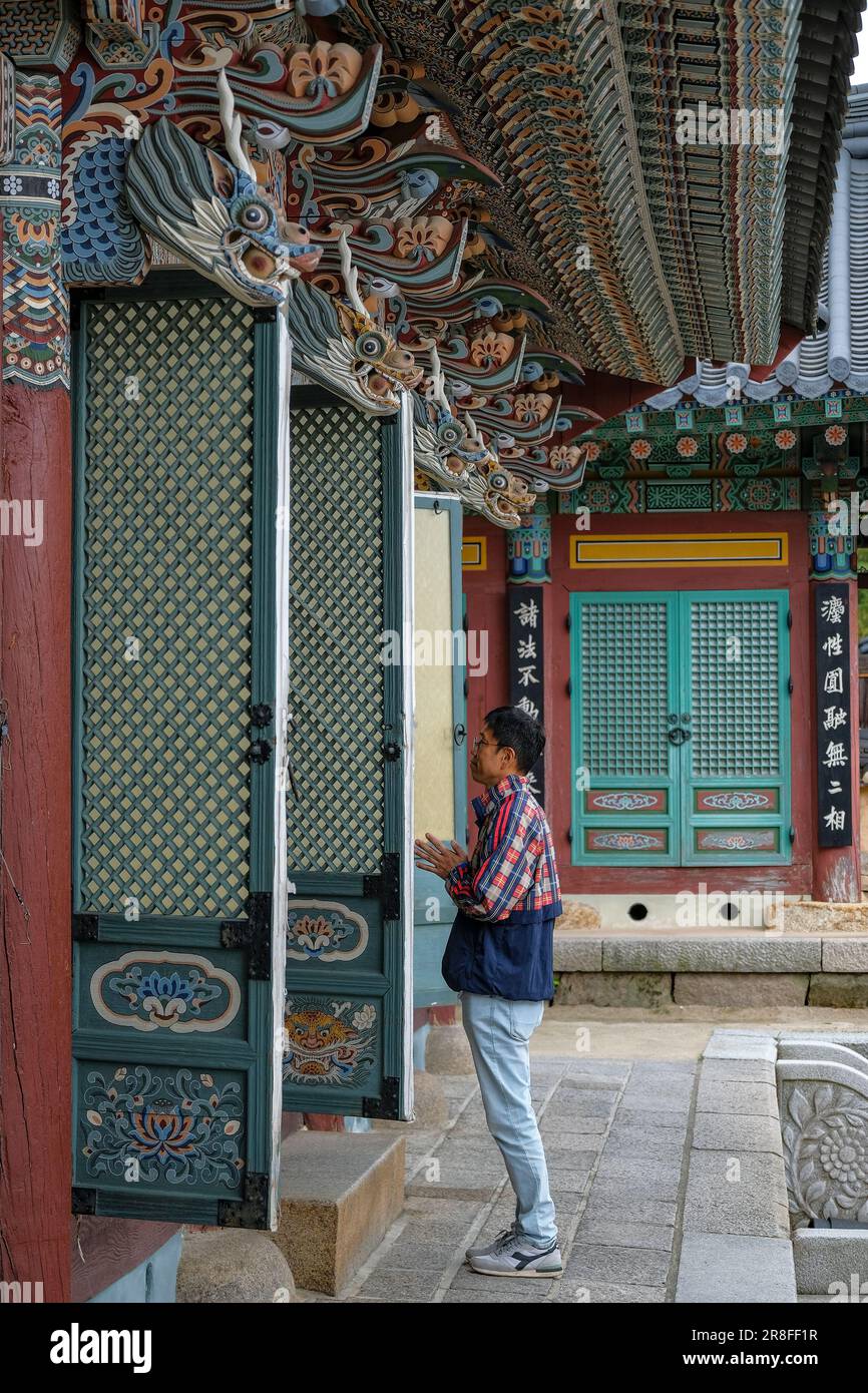 Busan, South Korea - May 30, 2023: A man praying at the Beomeosa Temple ...