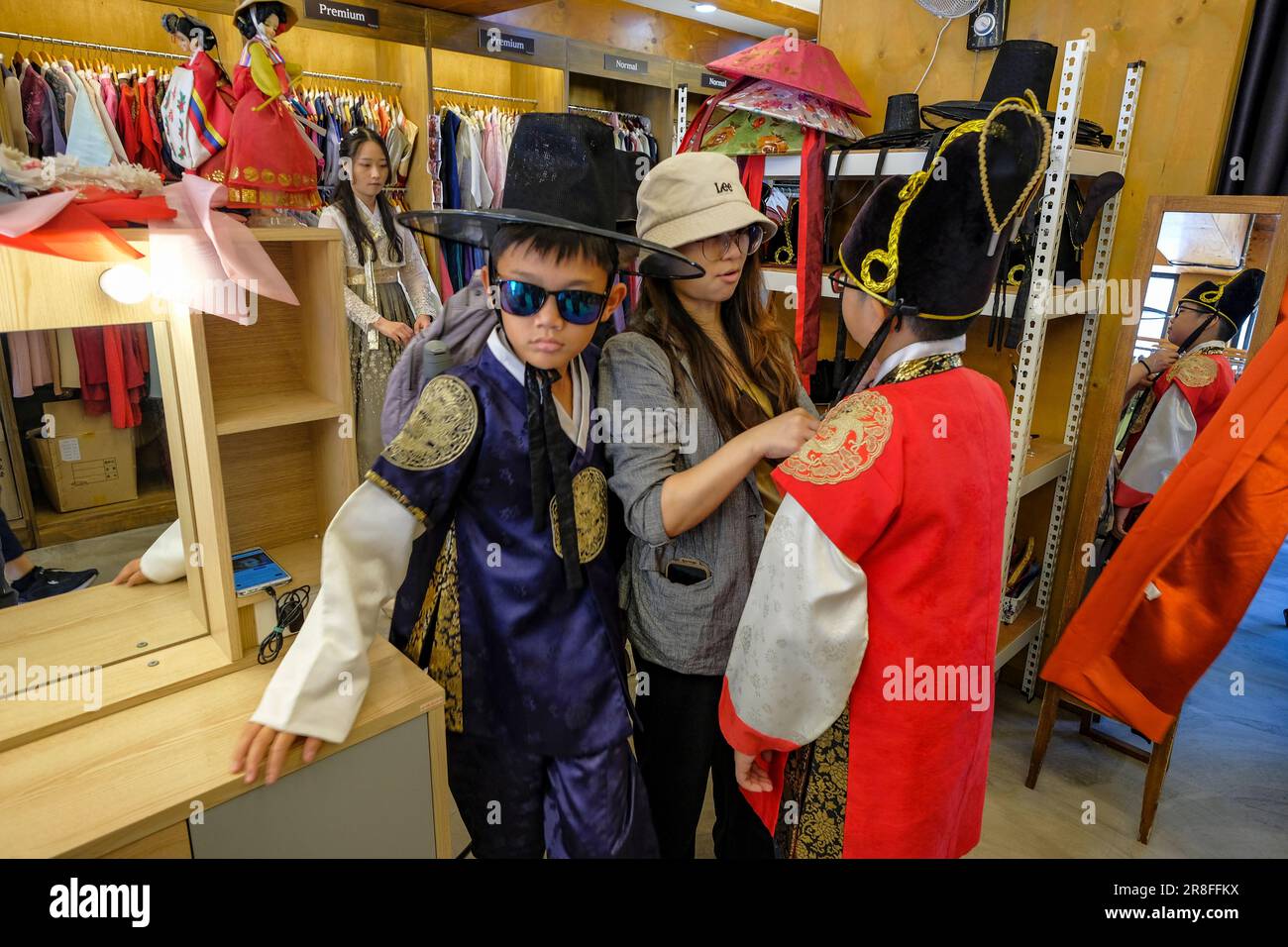 Busan, South Korea - May 30, 2023: People trying on traditional ...