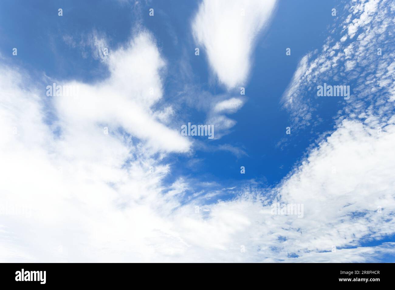 Blue sky background with tiny clouds Stock Photo - Alamy