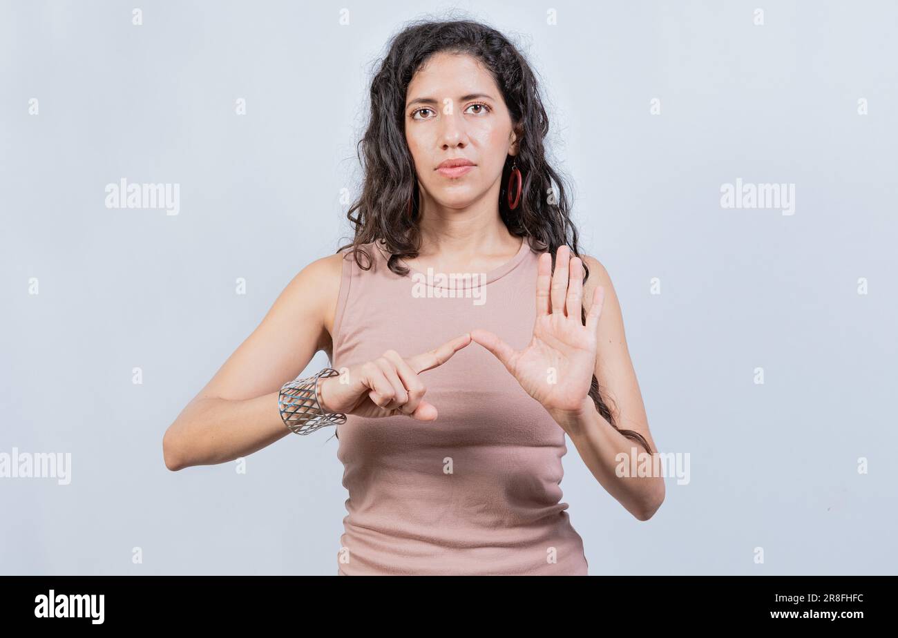 Lating girl gesturing in sign language isolated. Young woman gesturing ...