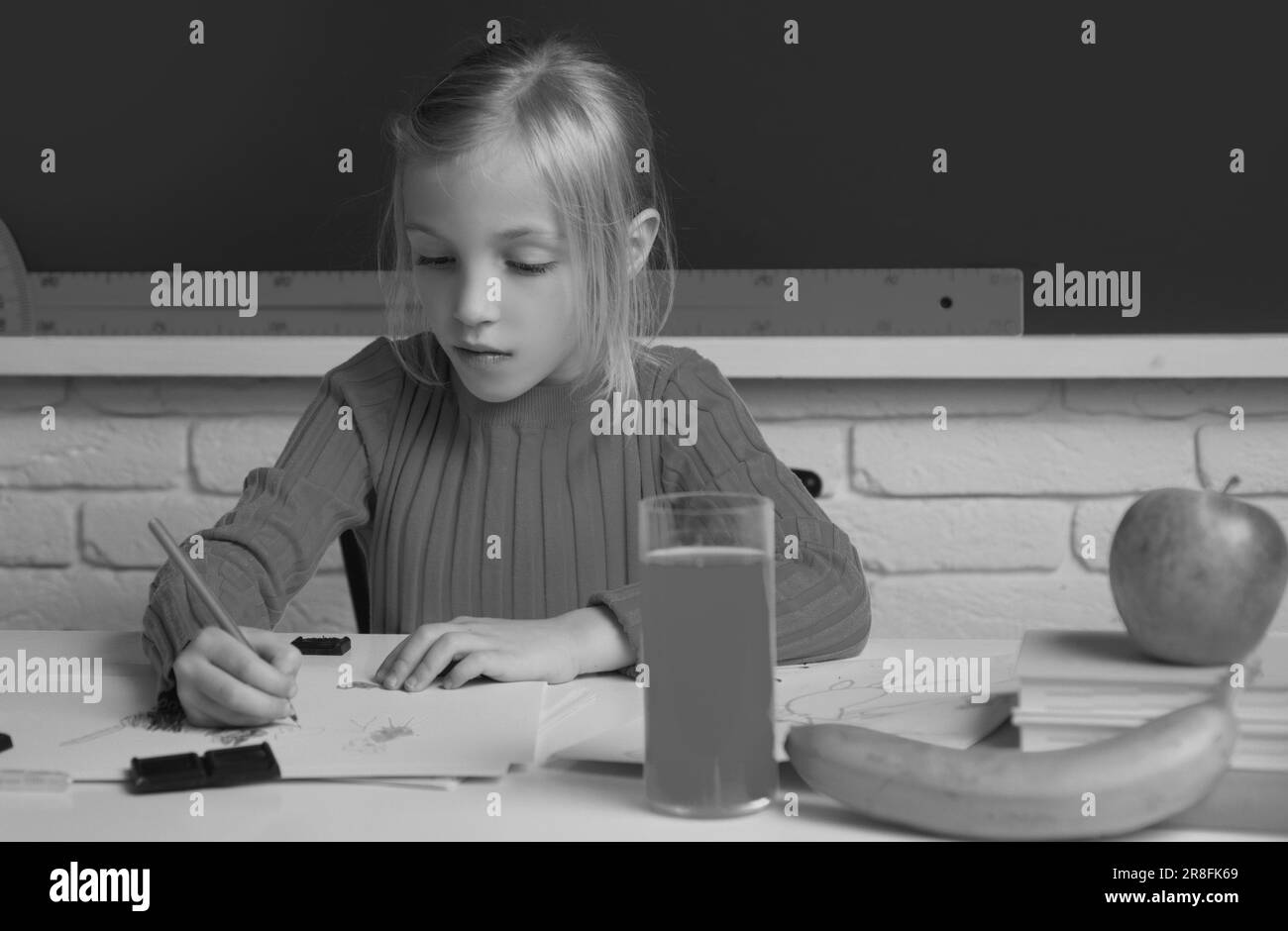 Cute little child studying in classroom at elementary school. Genius ...