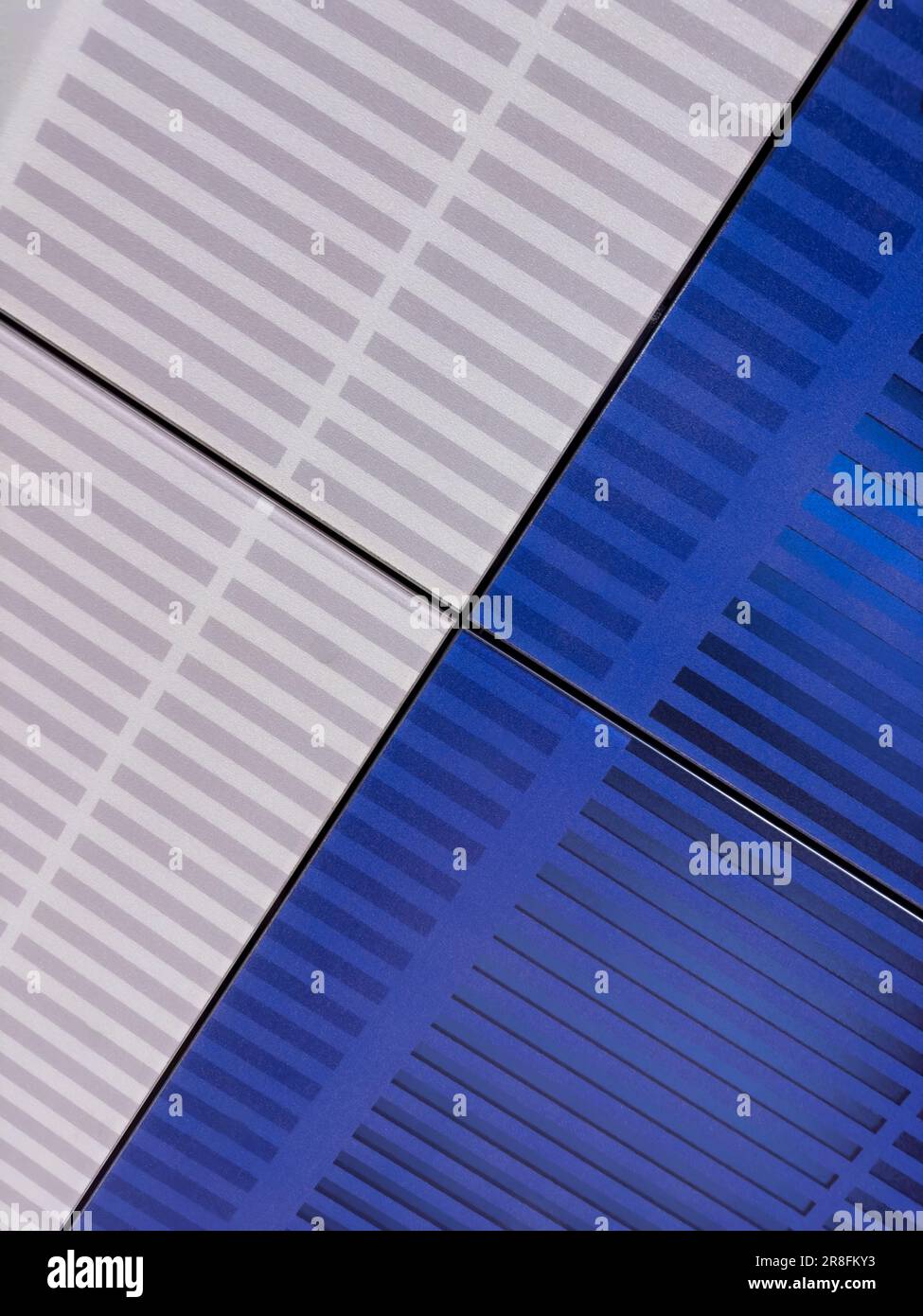 A close-up of two blue-painted wall panels adjacent to each other with ...