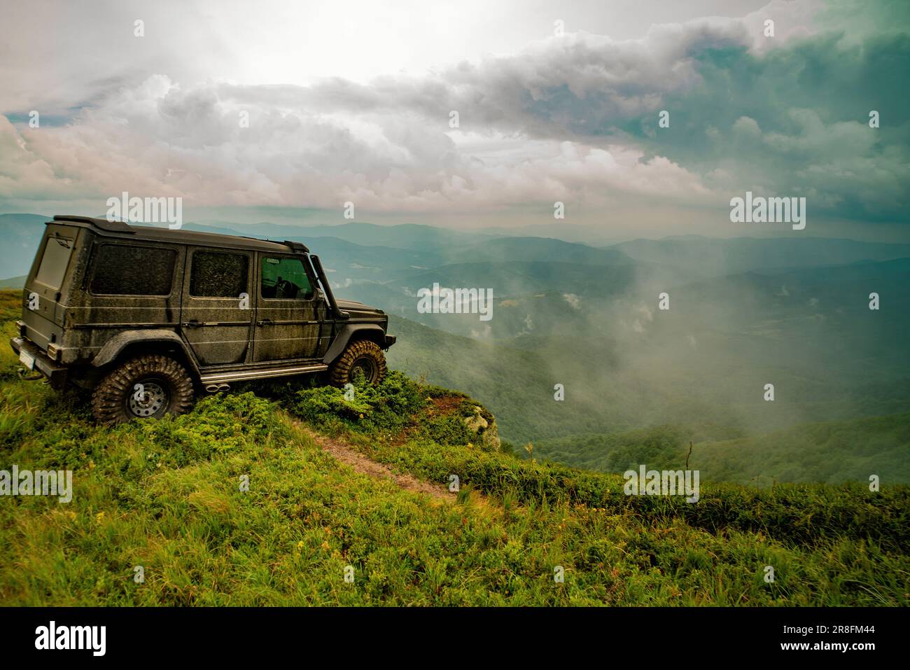 Classic 4x4 car crossing water with splashes on muddy road. Water ...