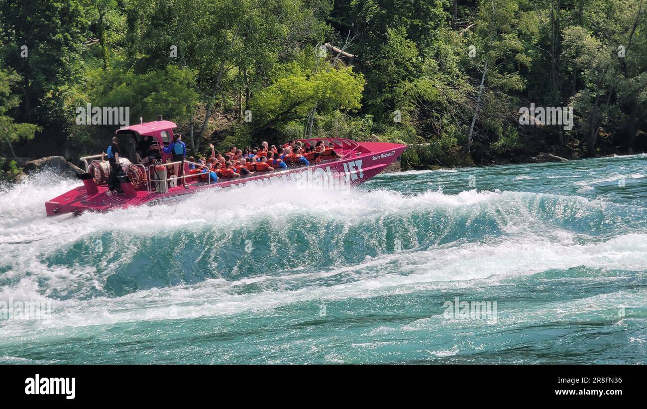 A group of tourists enjoying a sightseeing cruise with a Whirlpool jet ...