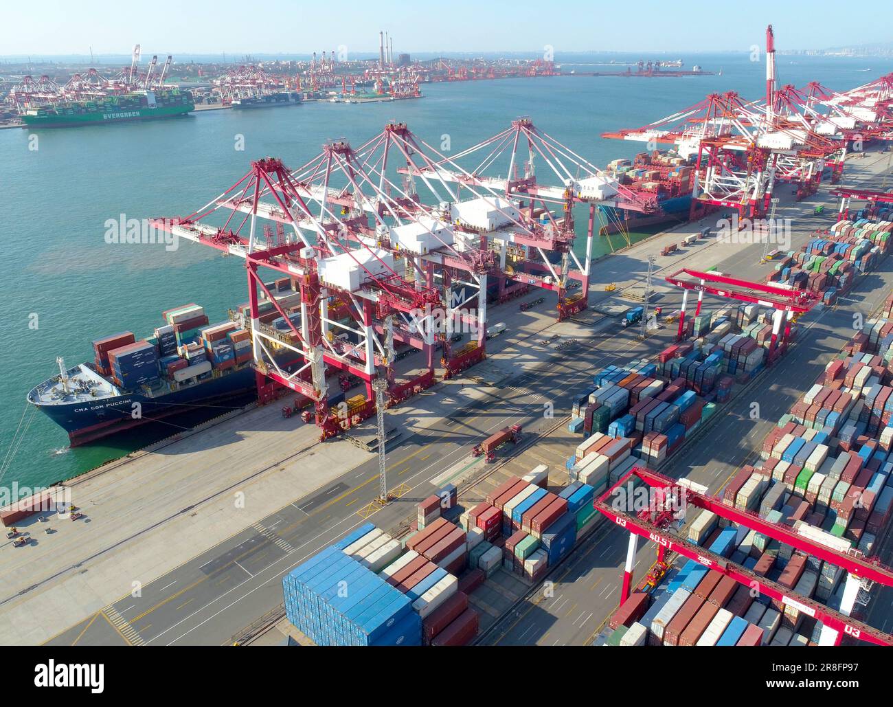 QINGDAO, CHINA - JUNE 21, 2023 - Dozens of freighters load and unload ...