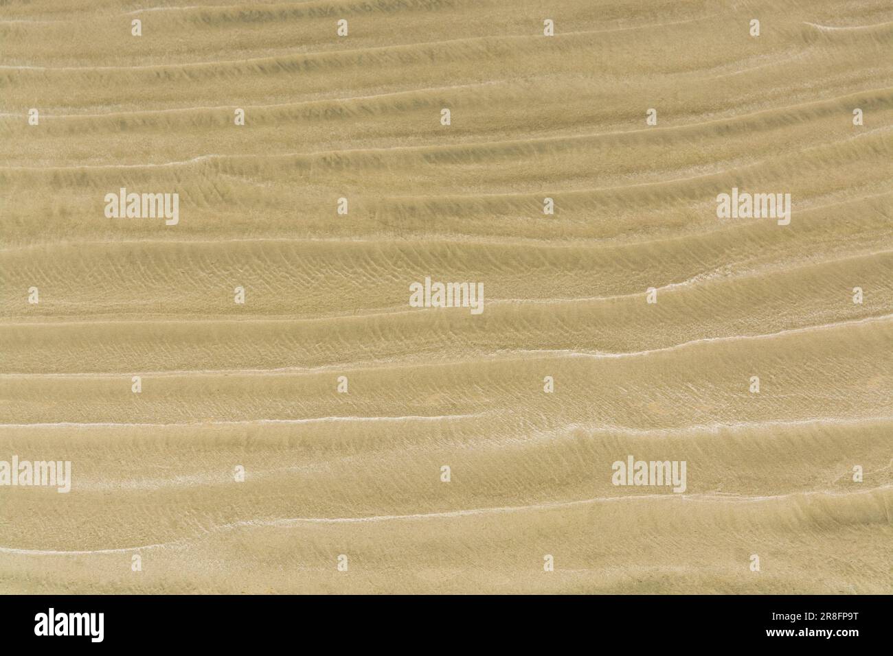 Waves of sand on one of Pacific ocean beaches Stock Photo - Alamy