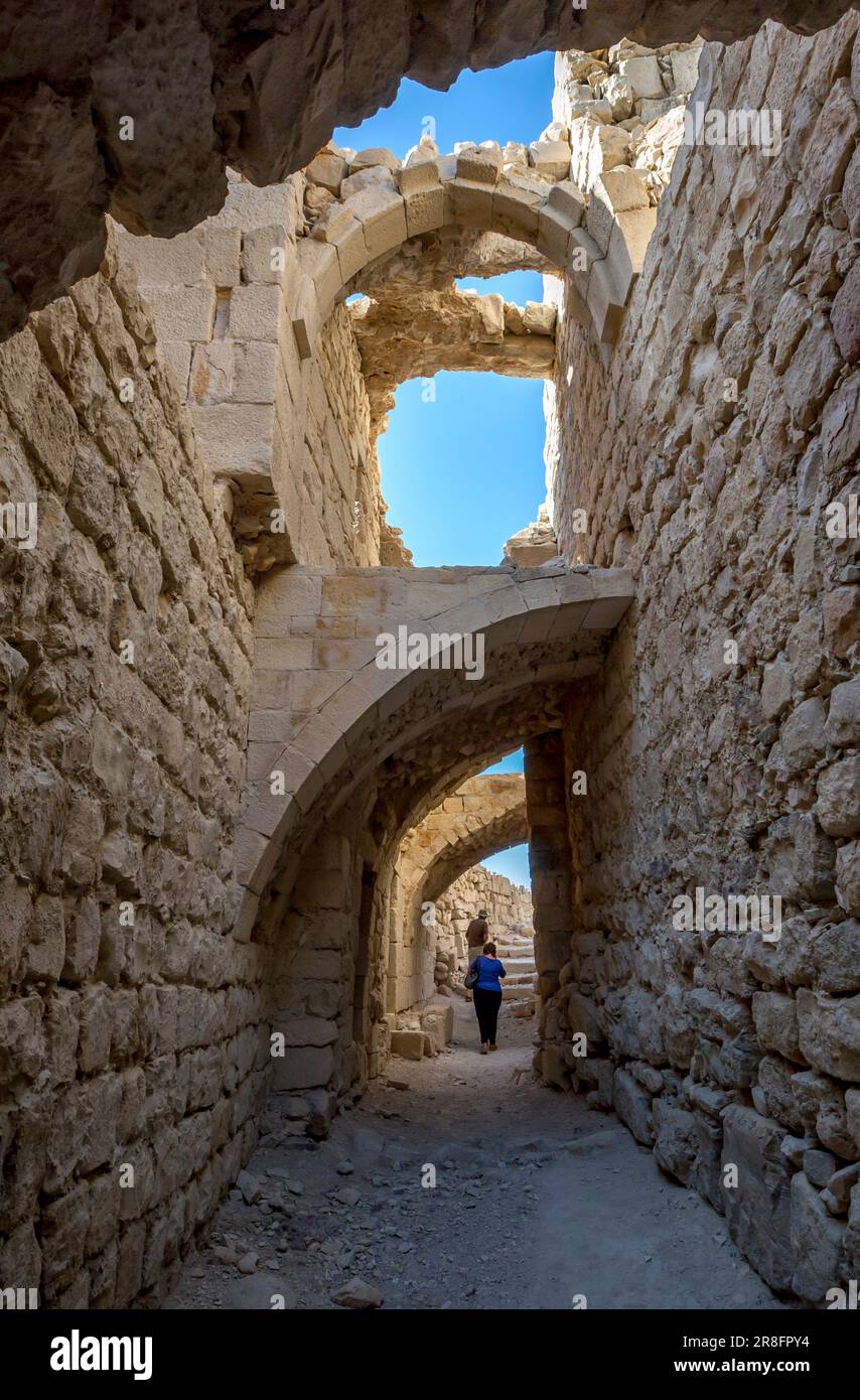 Tourists walk through a section of the ruins of Shobak Castle (Shoubak ...