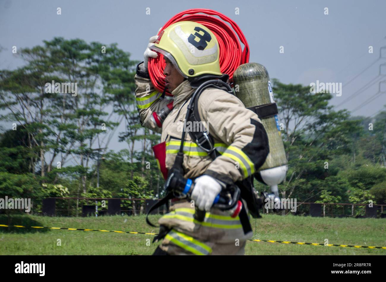 Bandung, Indonesia. 21st June, 2023. A firefighter attends a ...