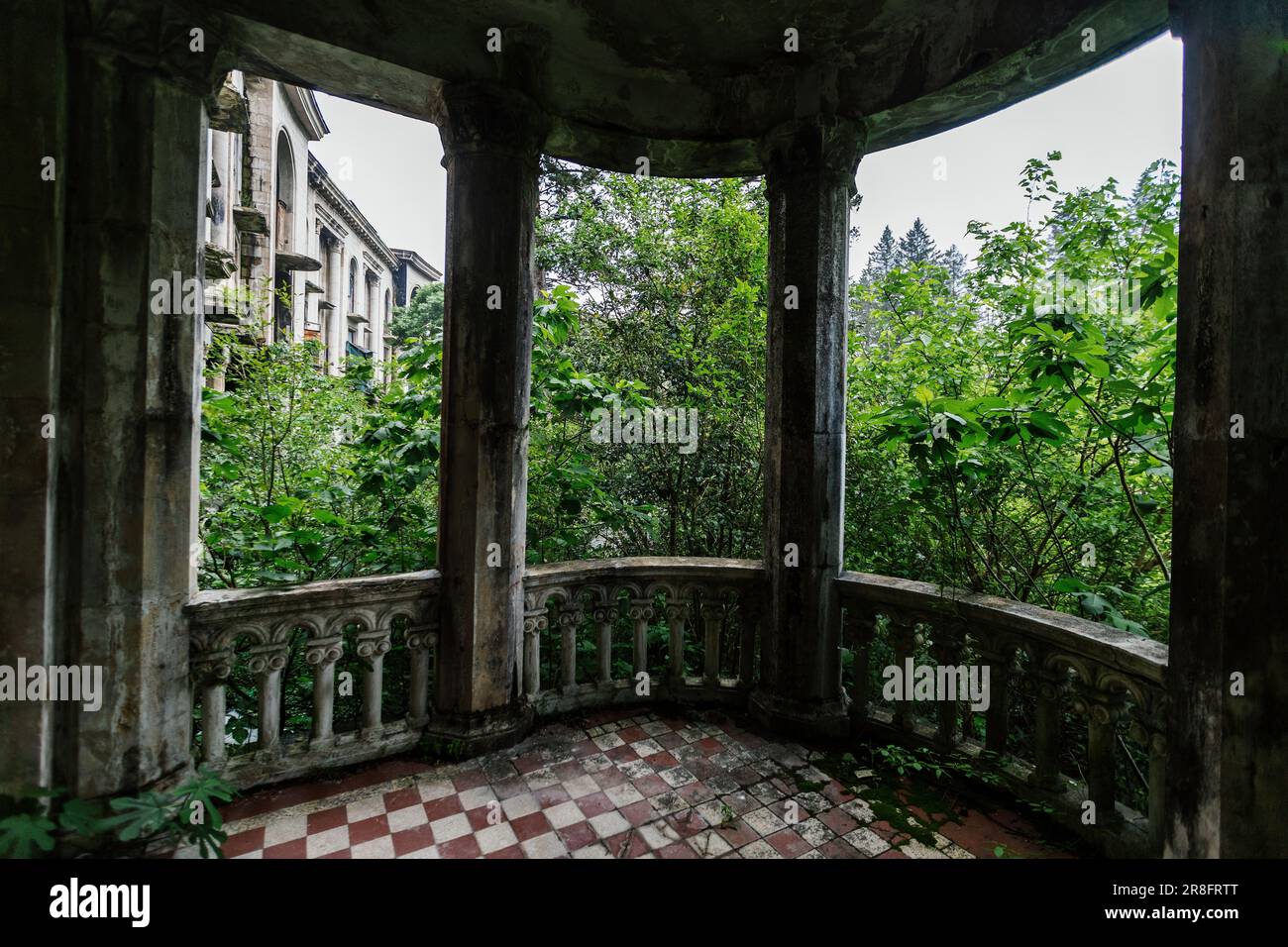 Old overgrown balcony in old abandoned mansion Stock Photo - Alamy