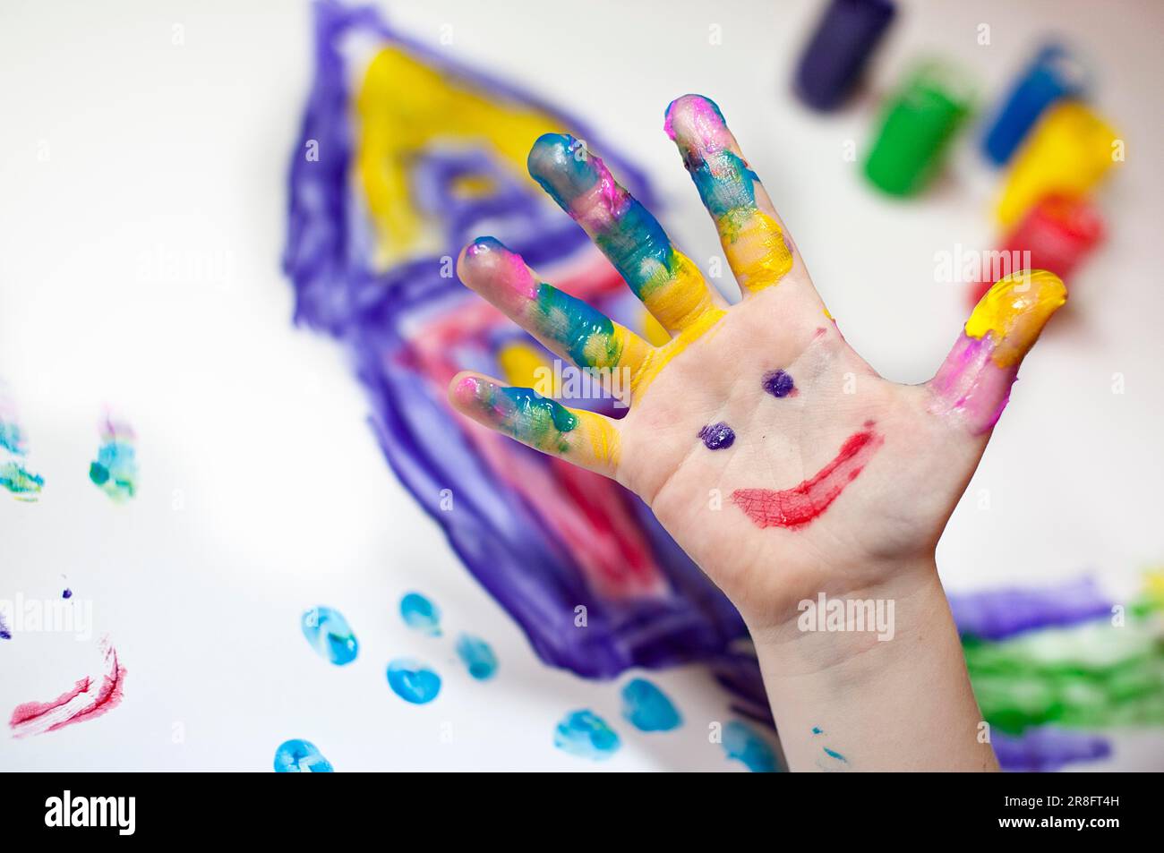 Small children's hands finger painting with different colours Stock ...
