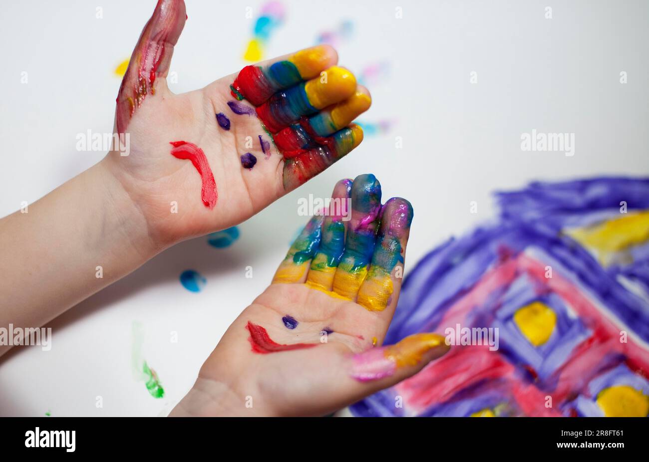 Small children's hands finger painting with different colours Stock ...