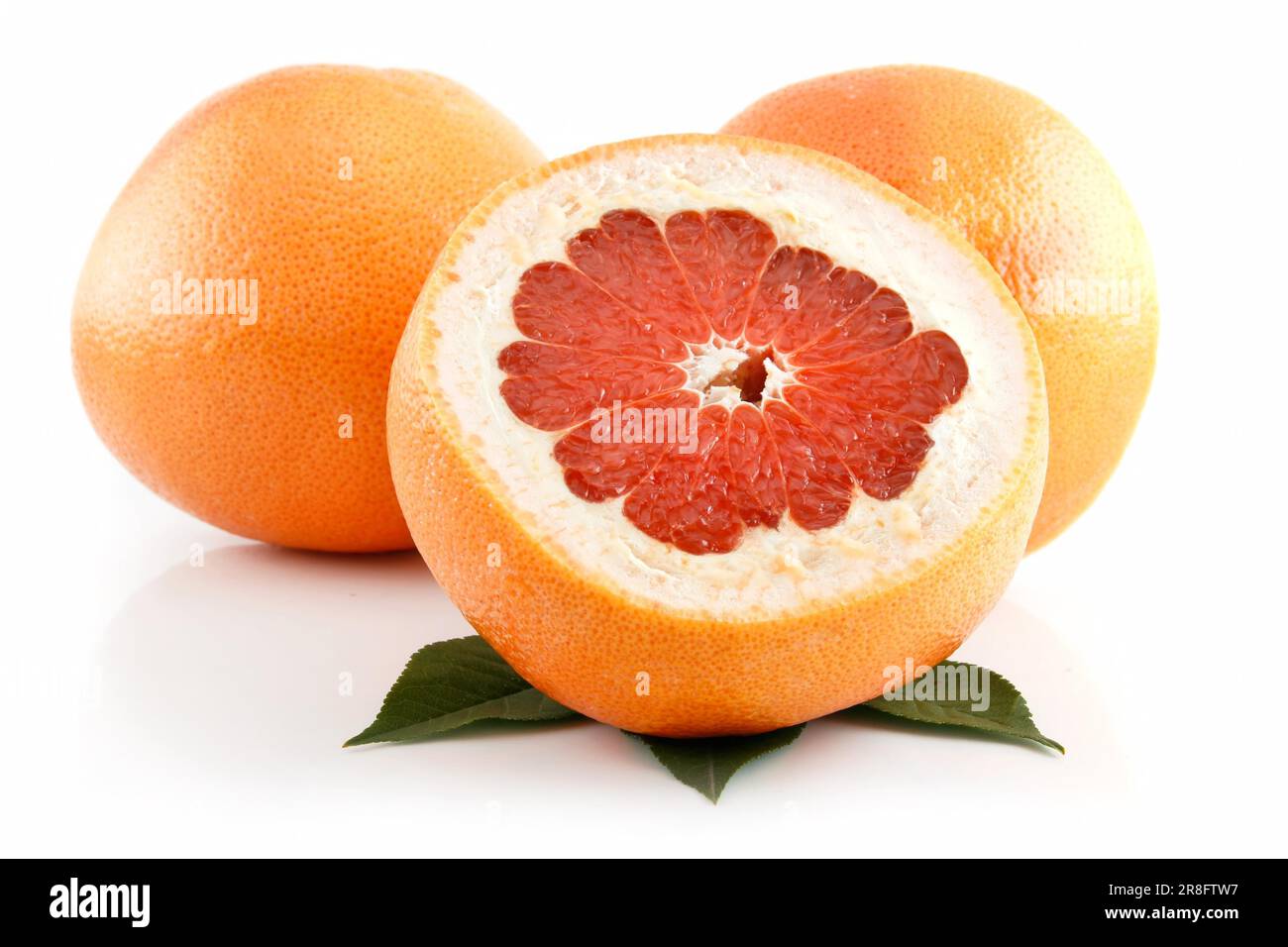 Ripe Sliced Grapefruit with Leaves Isolated on White Background Stock ...