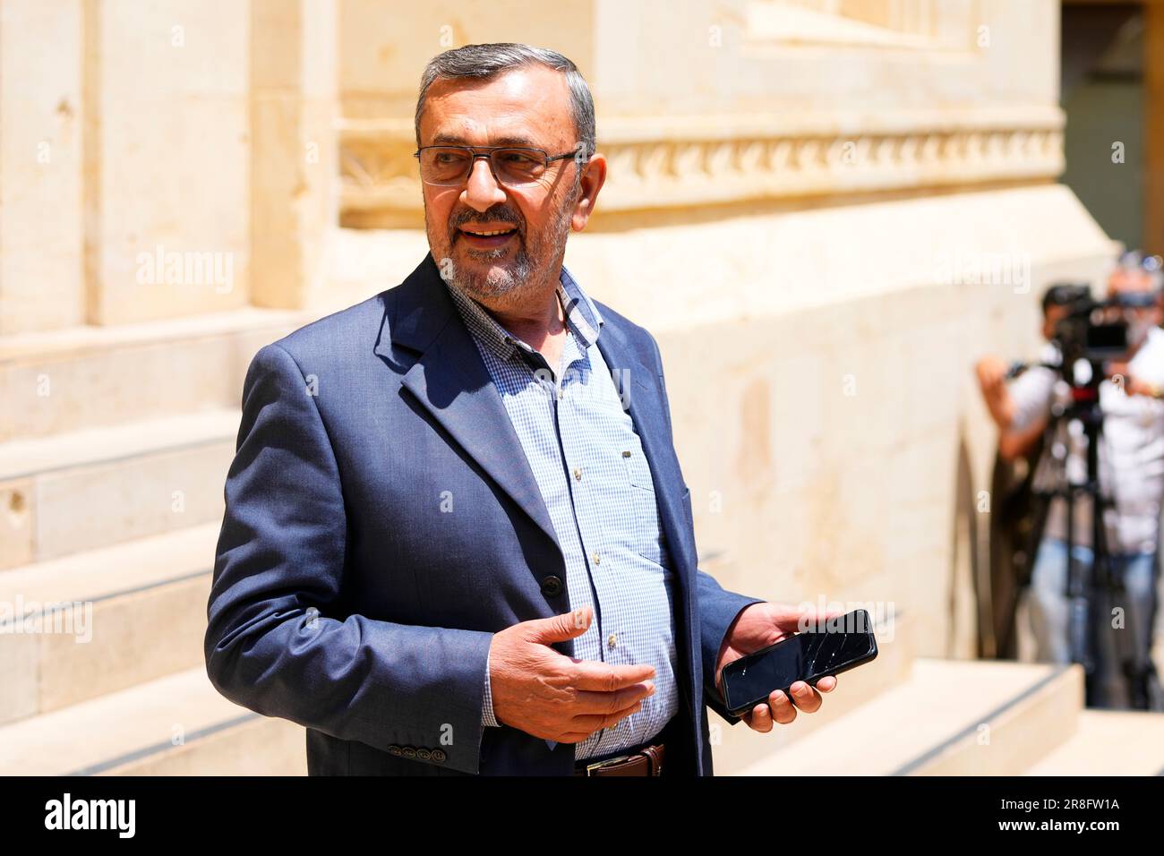 Lebanese lawmaker Hassan Ezzedine leaves the parliament building after ...