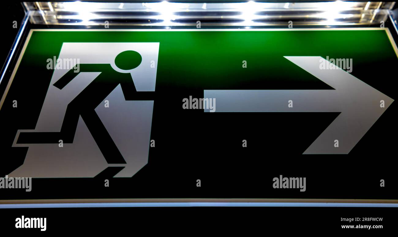 Illuminated Exit Sign Board Stock Photo - Alamy