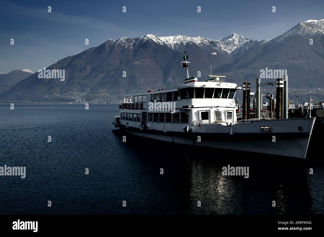 Passenger Ship on Alpine Lake Maggiore with Snow-capped mountain in ...